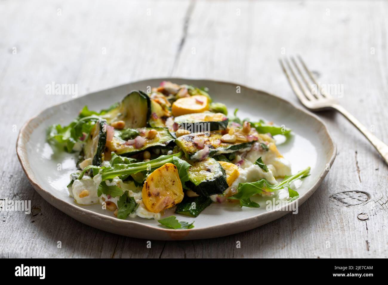 Baby courgette salad on ricotta cheese Stock Photo - Alamy