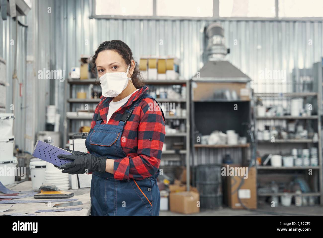 Cute female master being in the workshop Stock Photo - Alamy