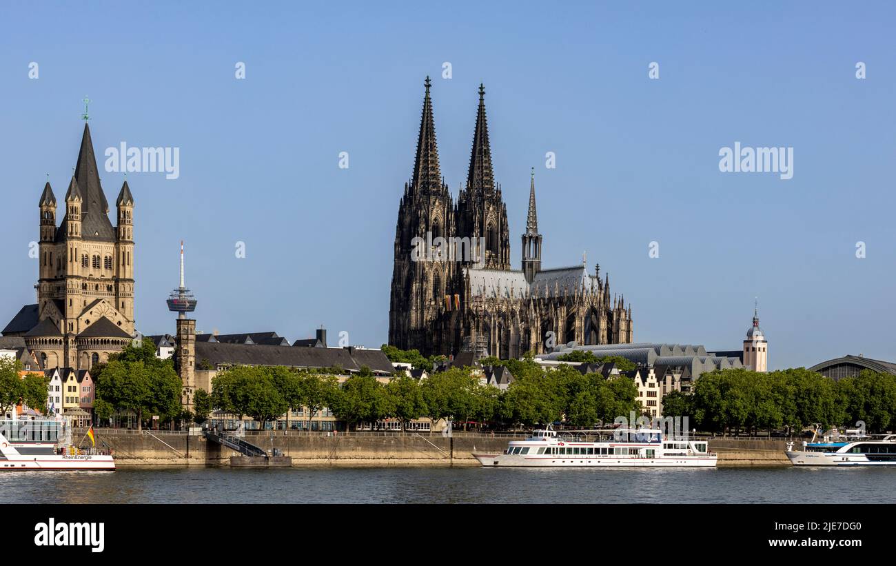 Large group of people gather to Cologne old town on a warm sunny day ...