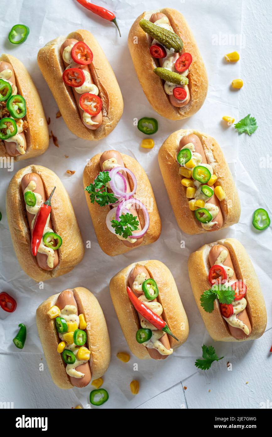 Spicy and delicious mini hot dogs with various toppings. Mini hot dogs ...