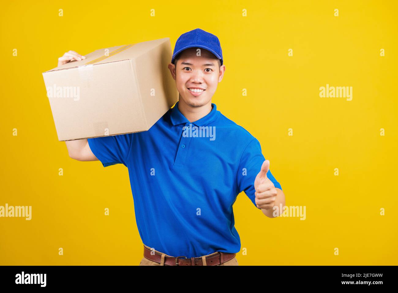 Portrait excited delivery happy man logistic standing he smile wearing ...