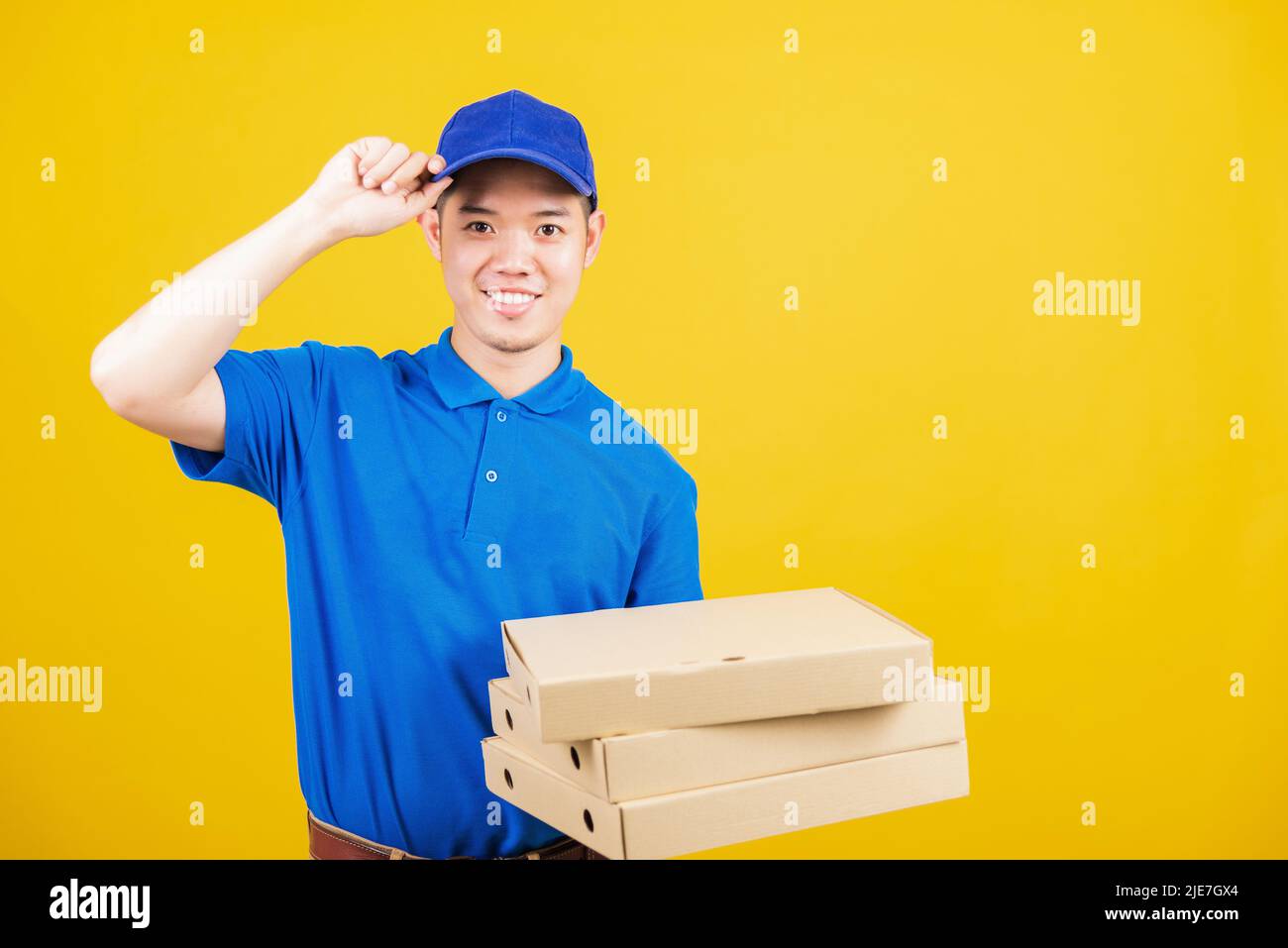 Portrait excited delivery service man standing he smile wearing blue t ...