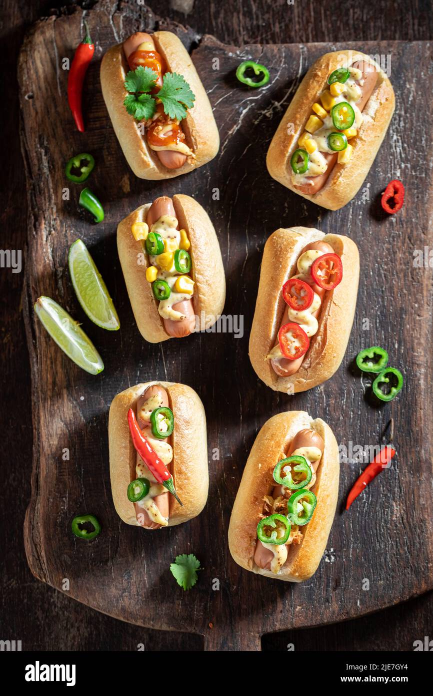 Fresh and tasty mini hot dogs as fast food. Mini hot dogs with colorful ...