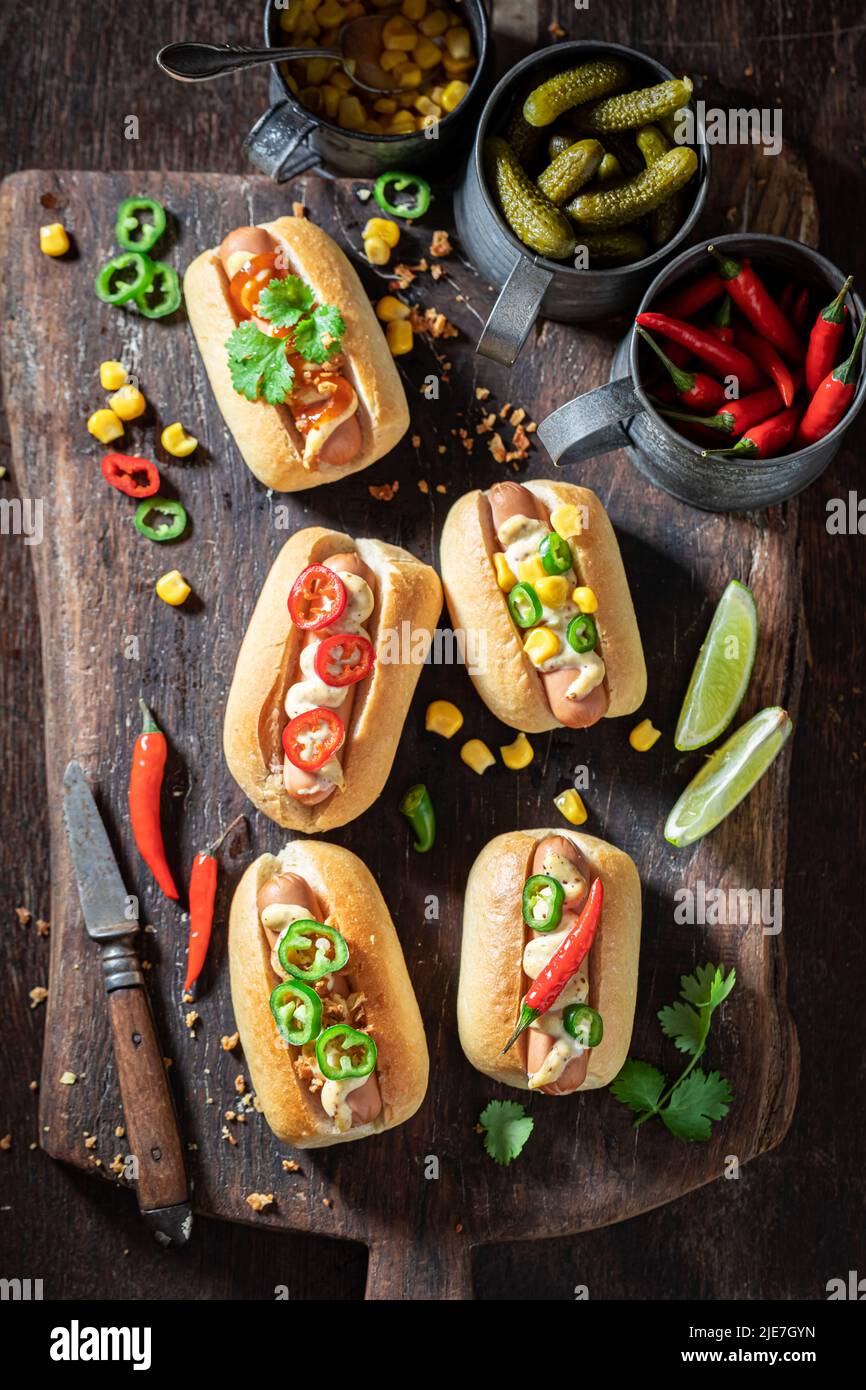 Hot and homemade mini hot dogs with various toppings. Mini hot dogs ...