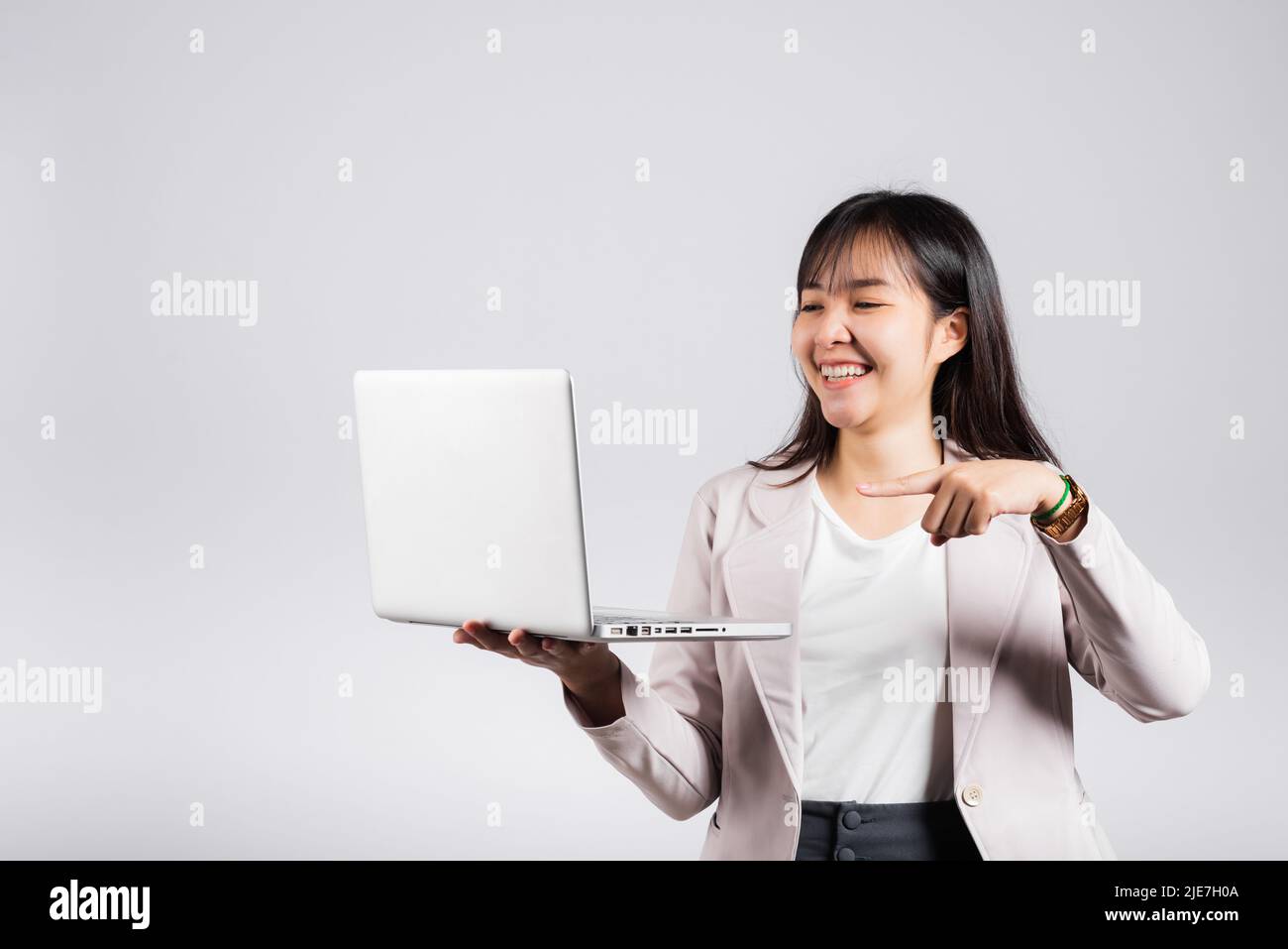 Woman teen smiling confident smiling face holding using laptop computer ...