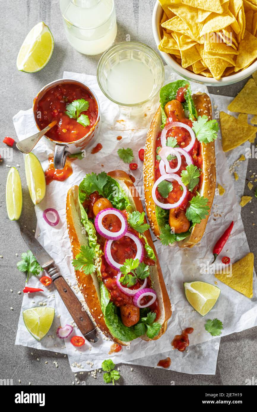 Delicious and spicy barbecue hot dogs with coriander and red sauce. Hot ...