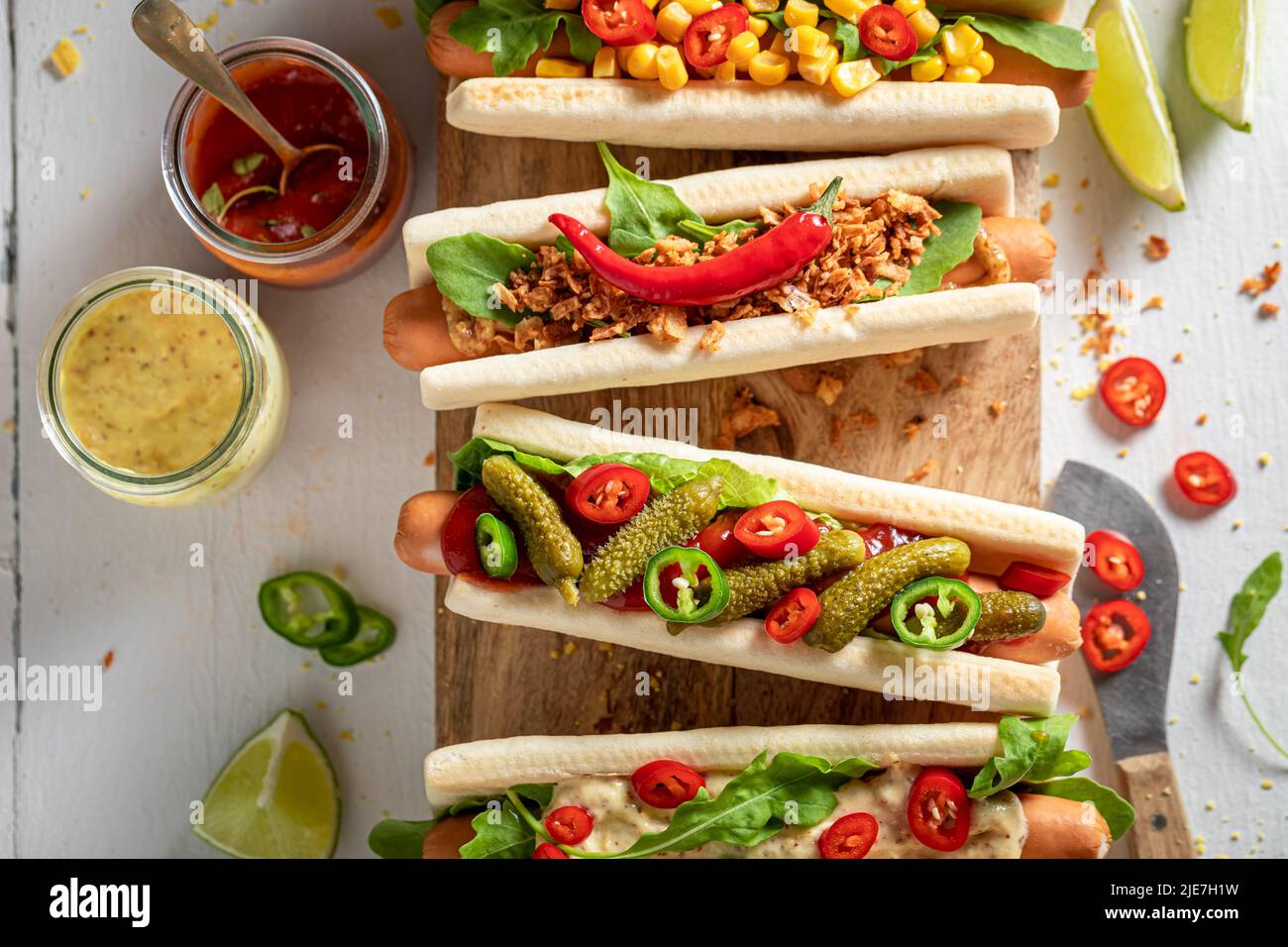 Unhealthy and tasty hot dogs with mustard and ketchup. Hot dogs made ...
