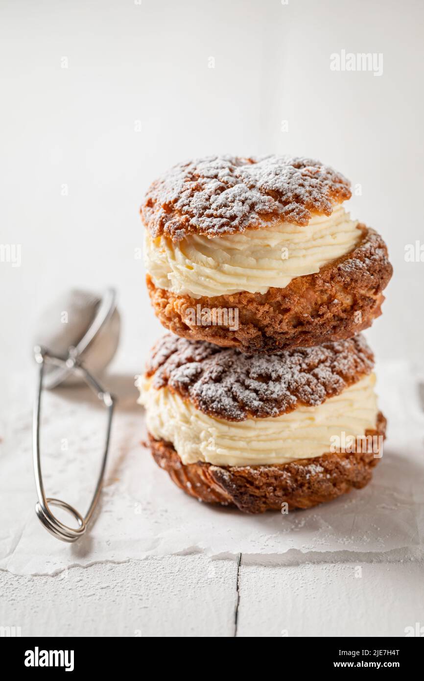 Tasty and homemade cream puffs with sugar and vanilla cream. Cream ...