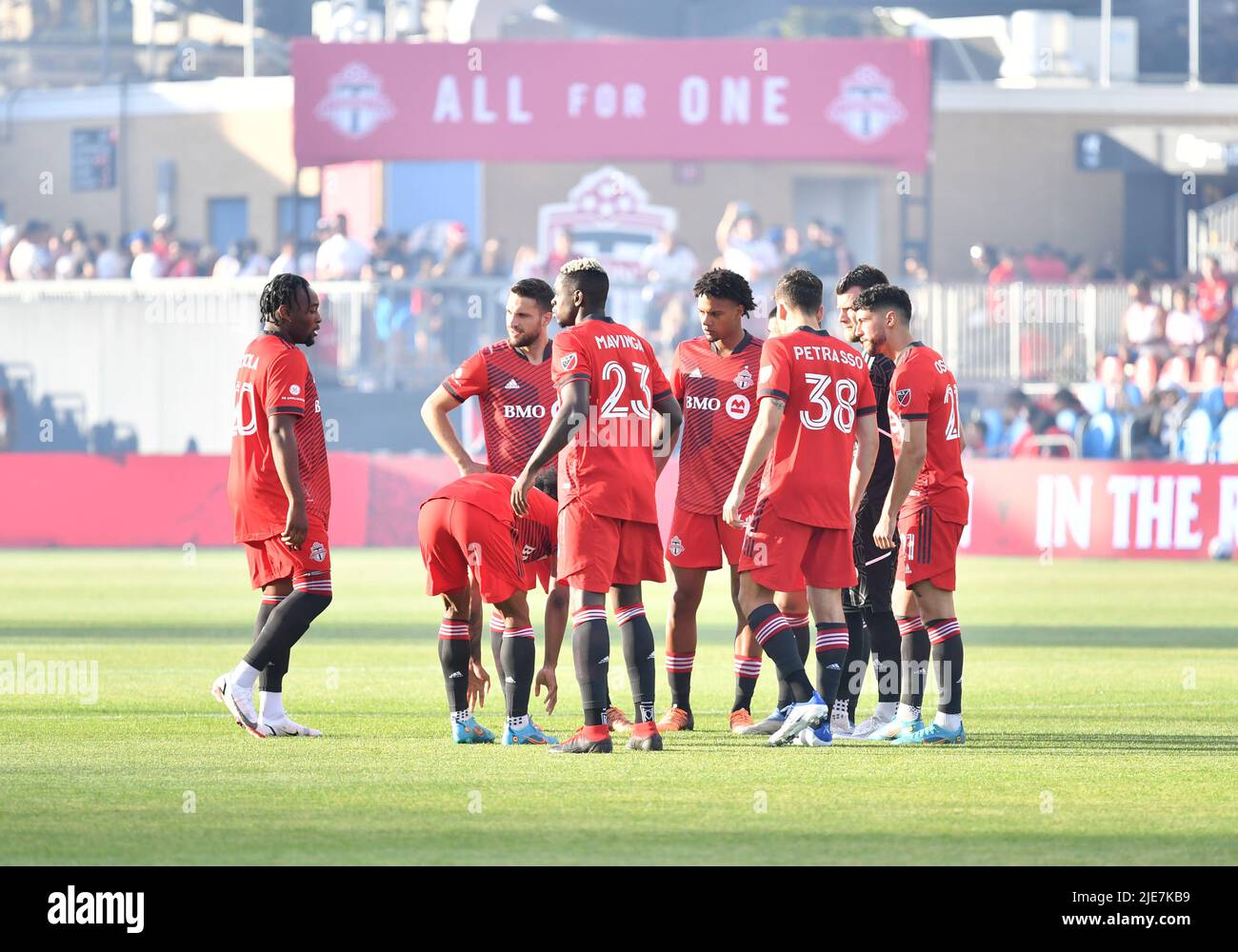 TORONTO, ON - JUNE 25: Toronto FC starting lineup huddles together ...