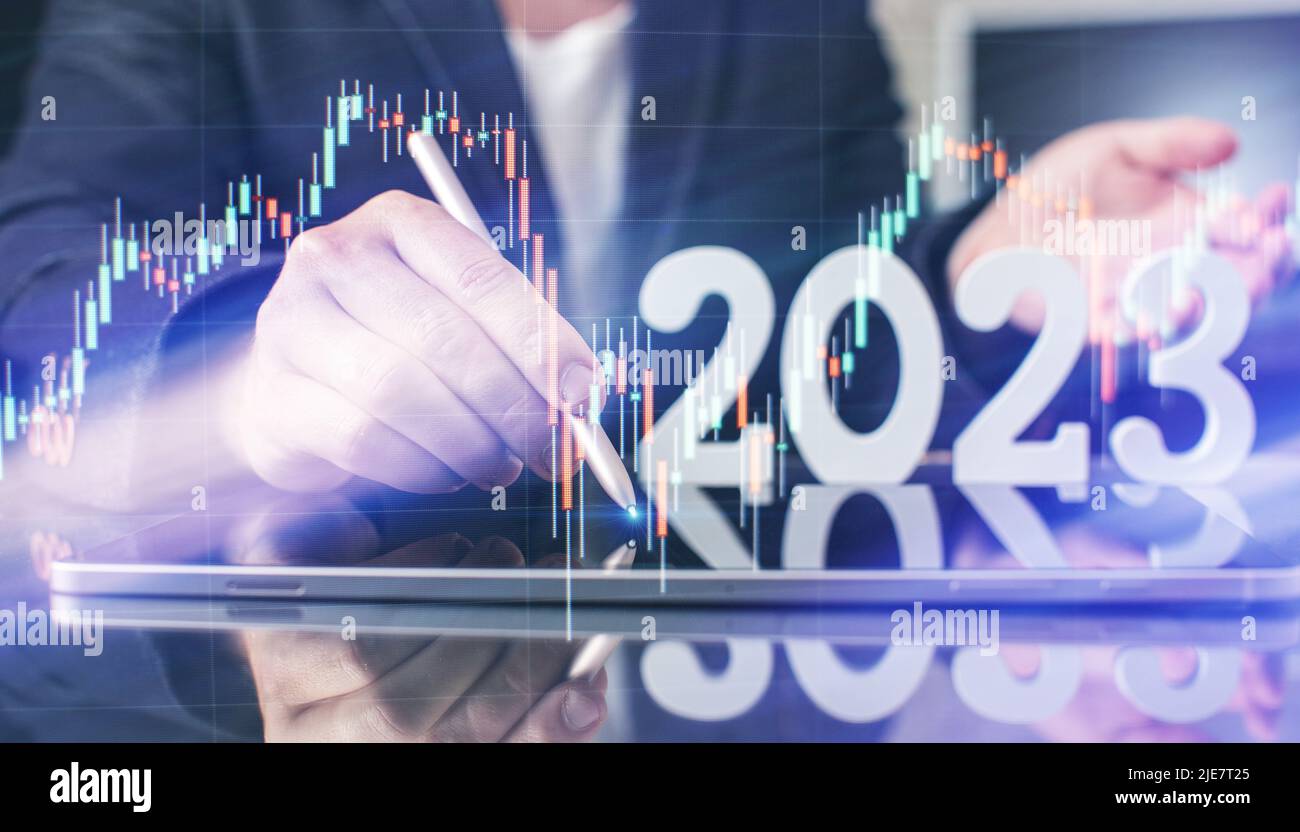 Hand write on tablet and touch screen. Stock market 2023 concept ...