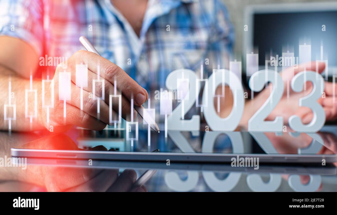 Hand write on tablet and touch screen. Stock market 2023 concept ...