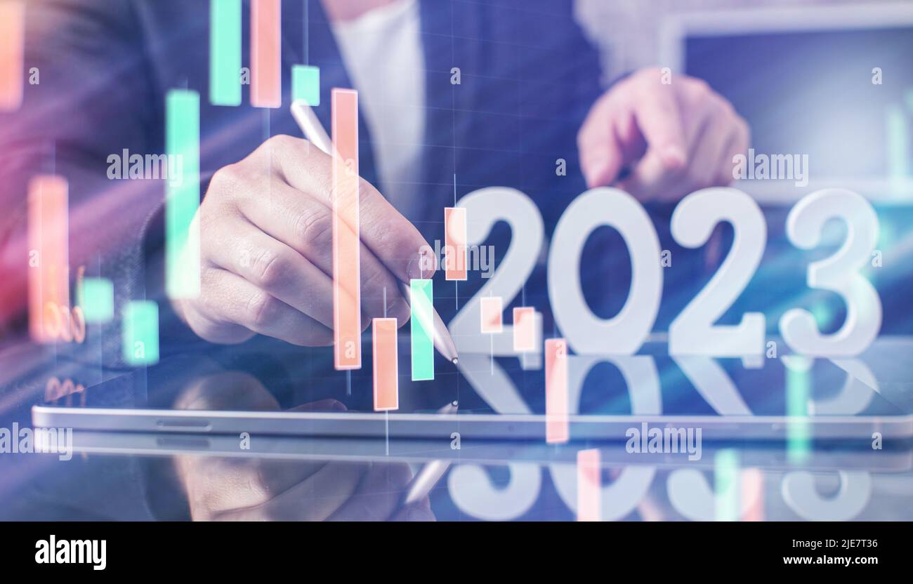 Hand write on tablet and touch screen. Stock market 2023 concept ...