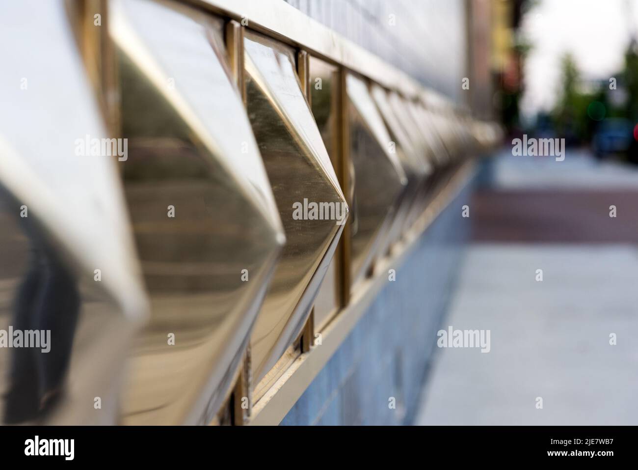 Building feature with reflective metal plated pyramid shapes Stock ...