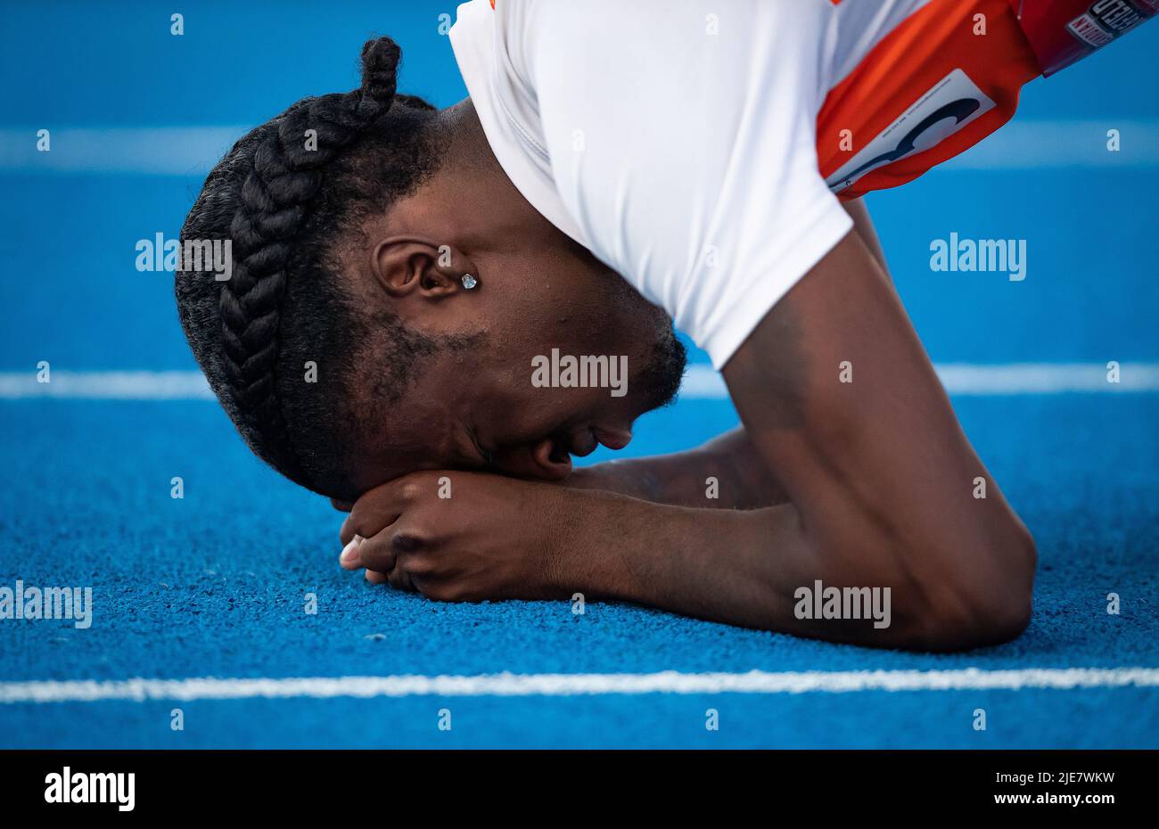 Almond Small, left, of Toronto, pauses on the track as he celebrates ...