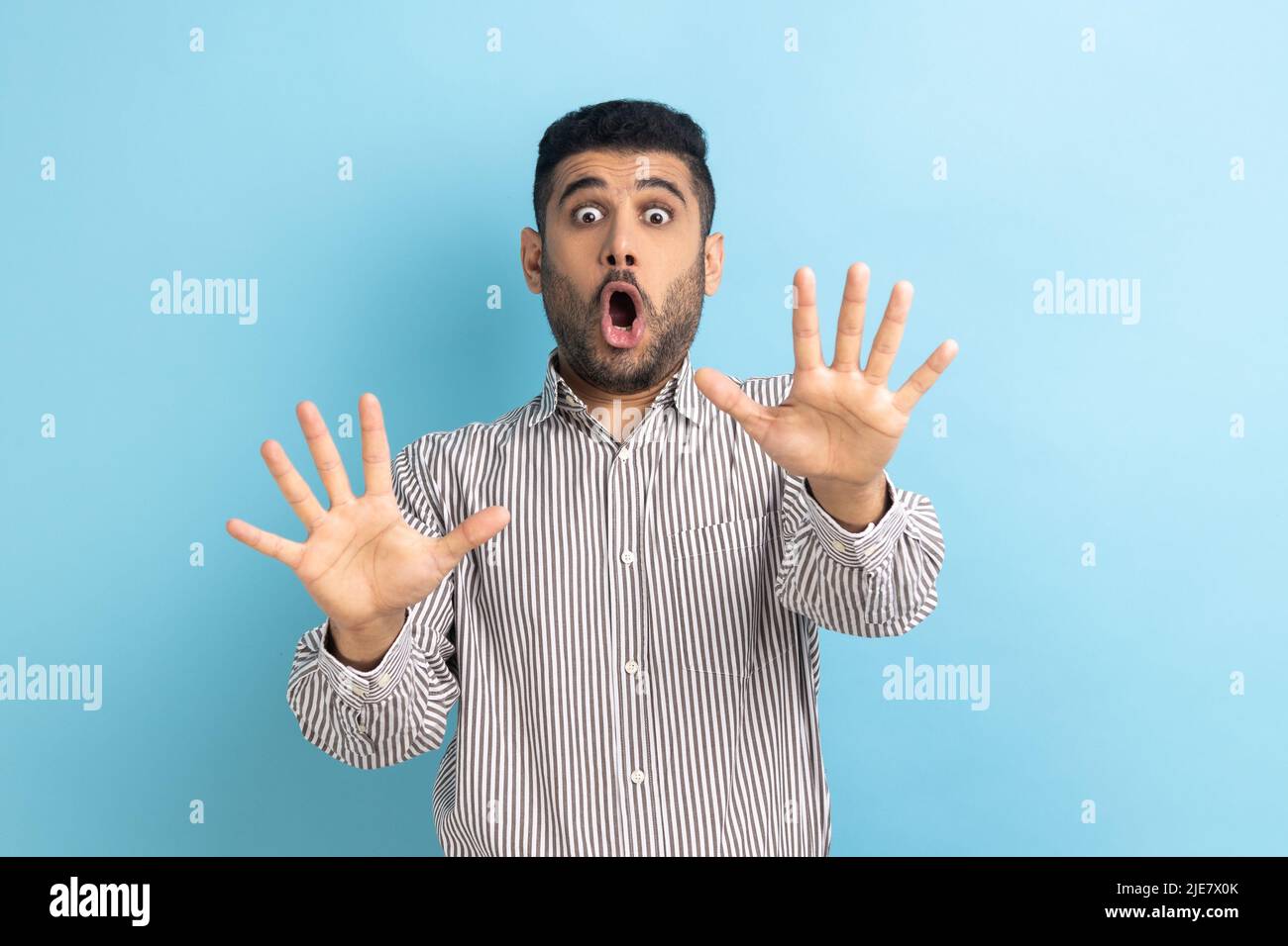 I'm afraid. Portrait of shocked scared bearded businessman screaming in ...