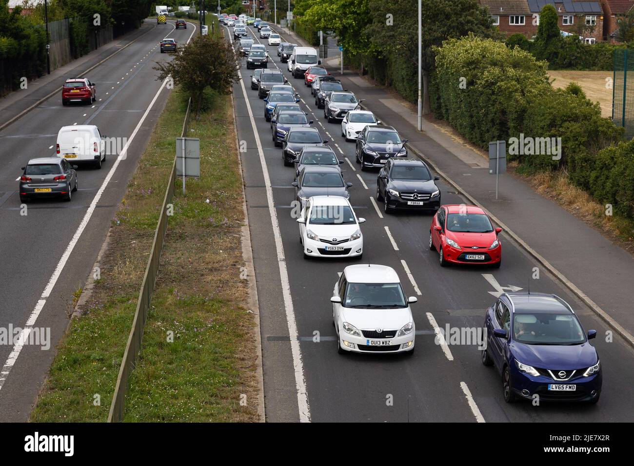 London, UK. 24th June, 2022. Heavy traffic builds on the A316 Chertsey ...