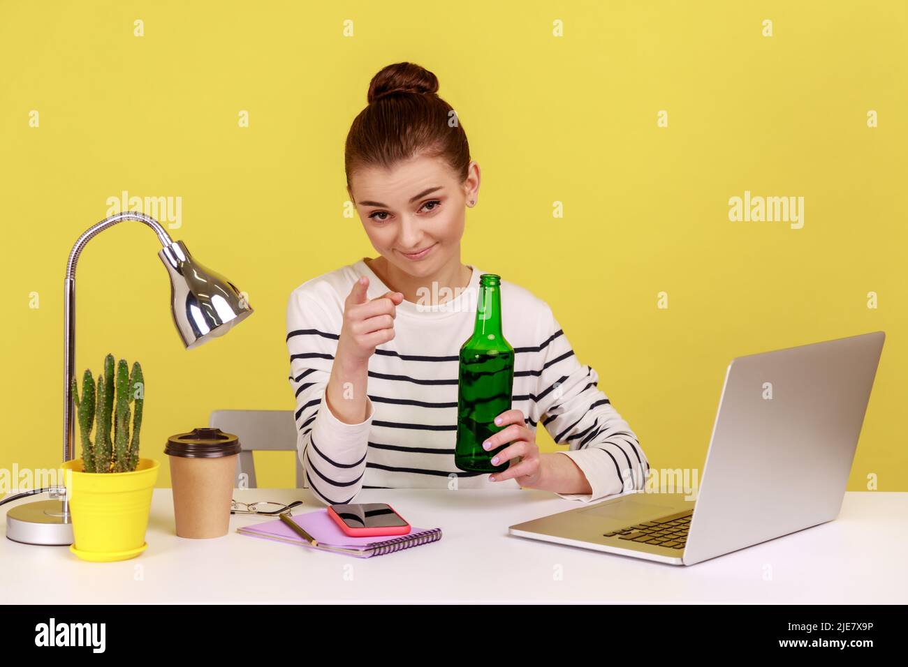 Portrait of attractive young adult woman office employee holding beer ...