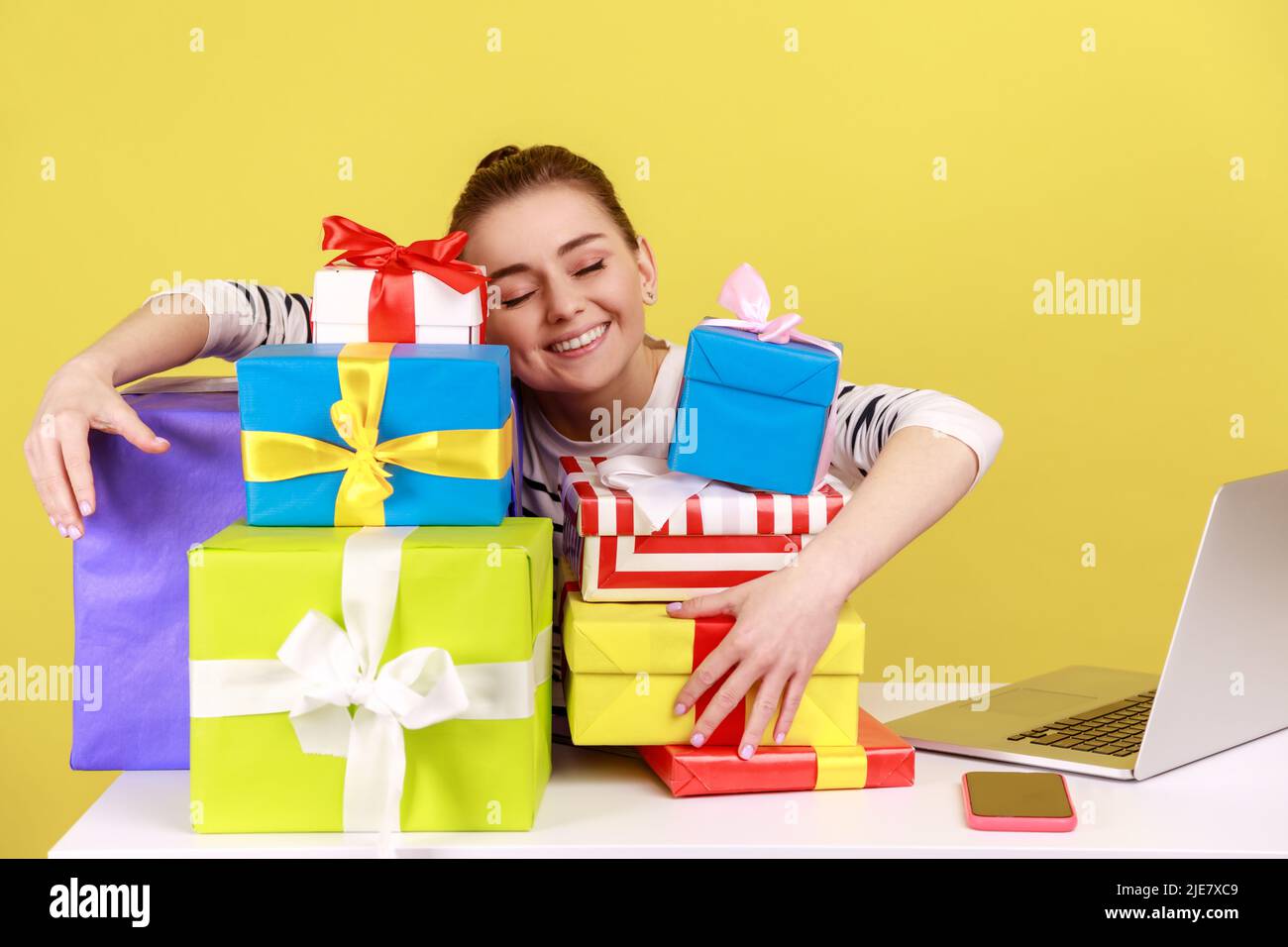 Young happy smiling satisfied woman office manager sitting on workplace ...