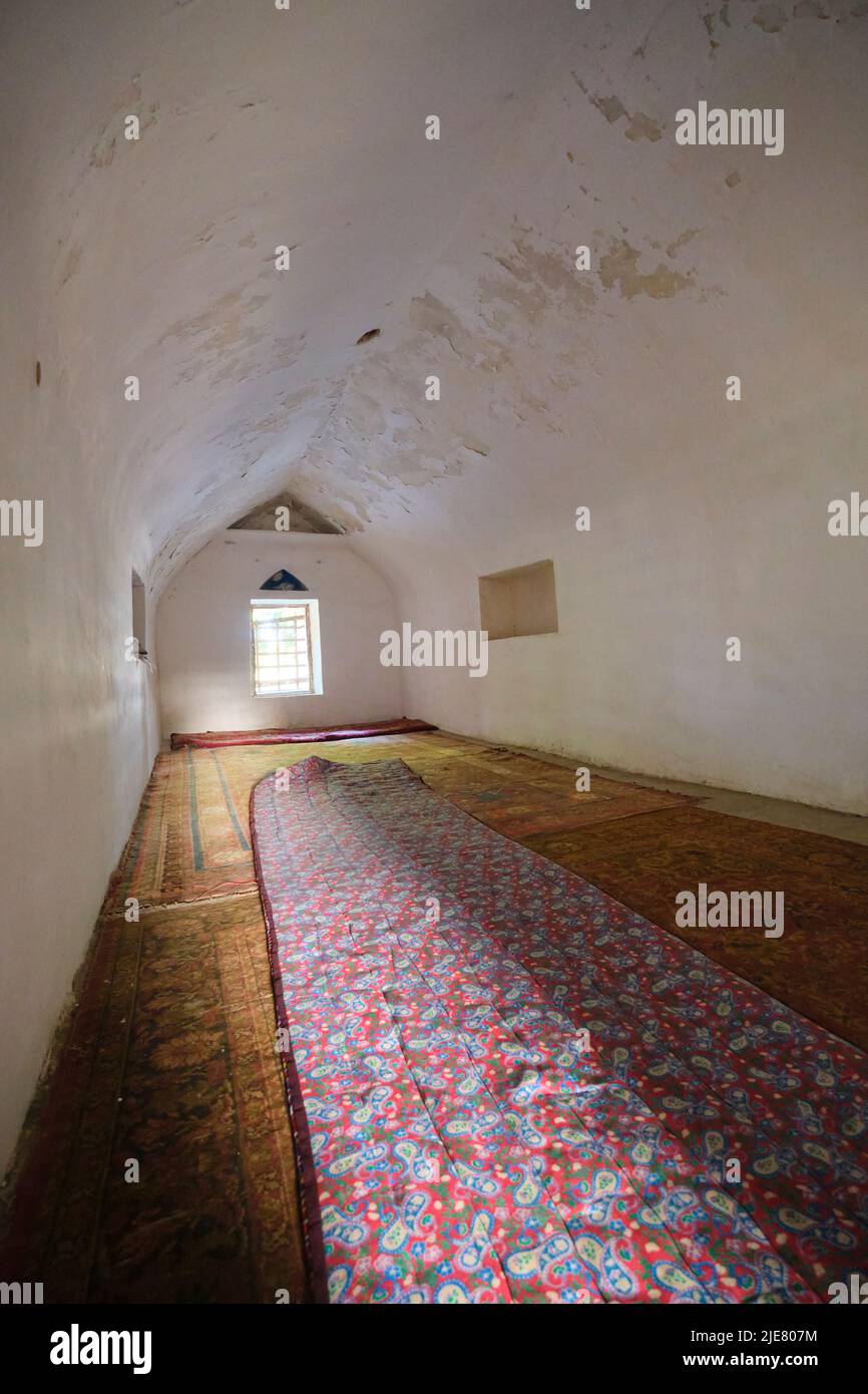 A private, small, intimate white arched space at the Norbutabiy Mosque ...
