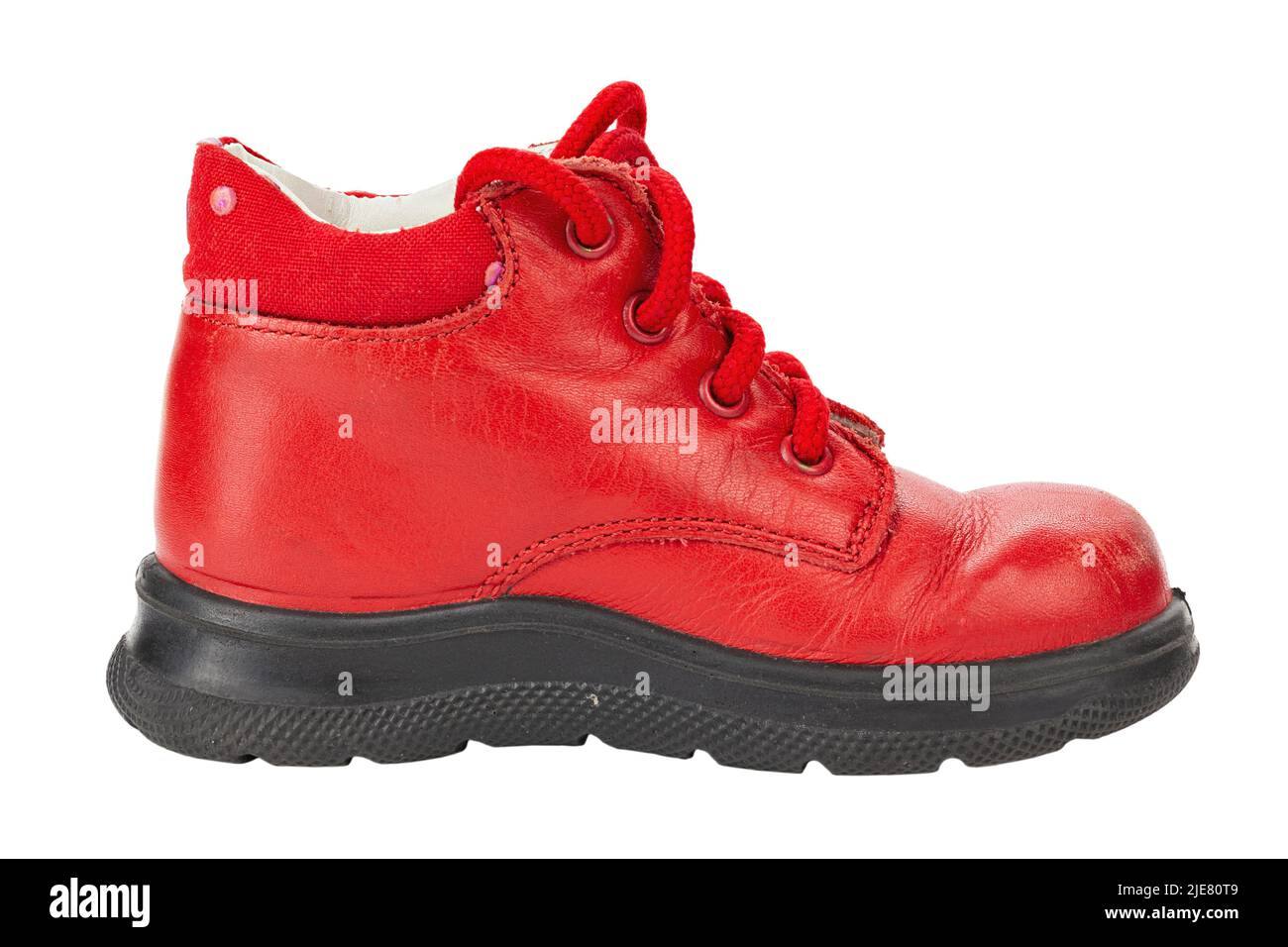 Children's shoes of red color isolated on white background. Old shoes ...