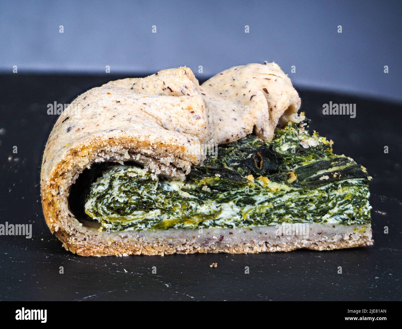 Homemade spinach and cheese small pie in slices for 1 person Stock ...