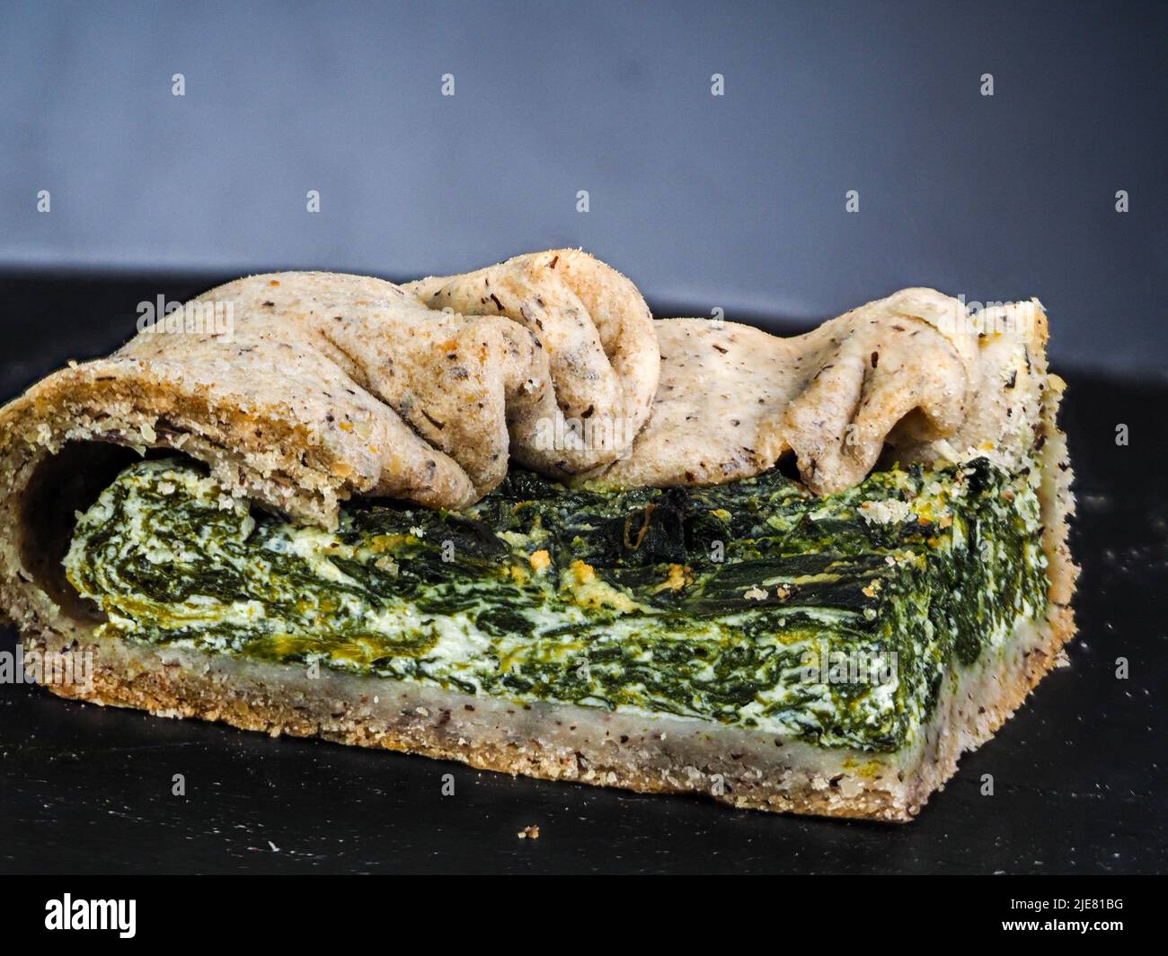 Homemade spinach and cheese small pie in slices for 1 person Stock ...