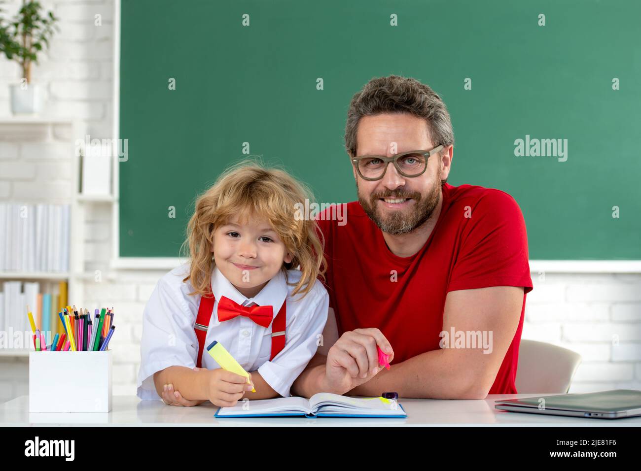 Back to school. Kid boy learning with teacher. Funny little boy study ...