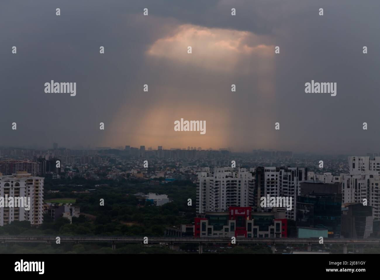 Sunlight beaming through storm clouds and falling on Gurugram,Haryana ...