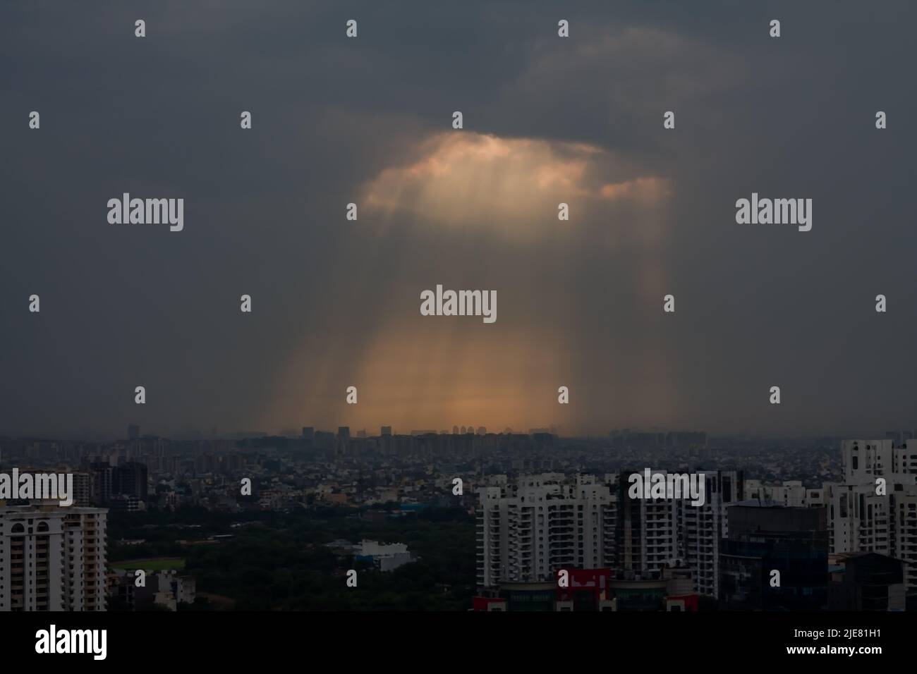 Sunlight beaming through storm clouds and falling on Gurugram,Haryana ...