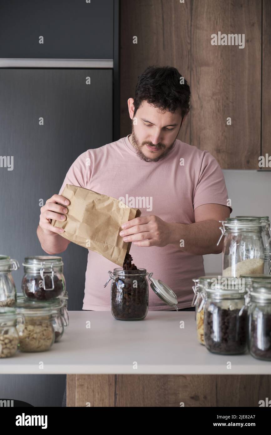 Man filling bag from store hi-res stock photography and images - Alamy