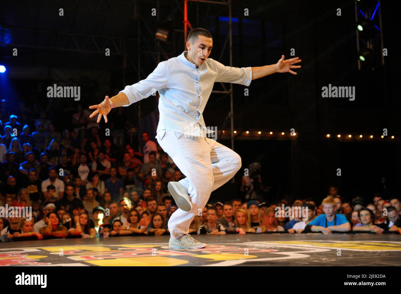 Young man break dancer performing on stage during breakdance battle ...