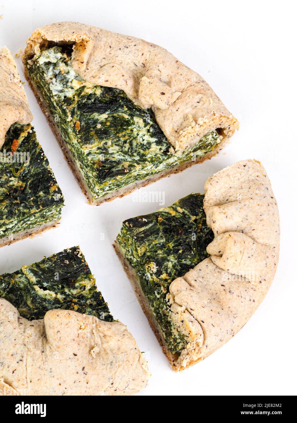 Homemade spinach and cheese small pie in slices for 1 person Stock ...