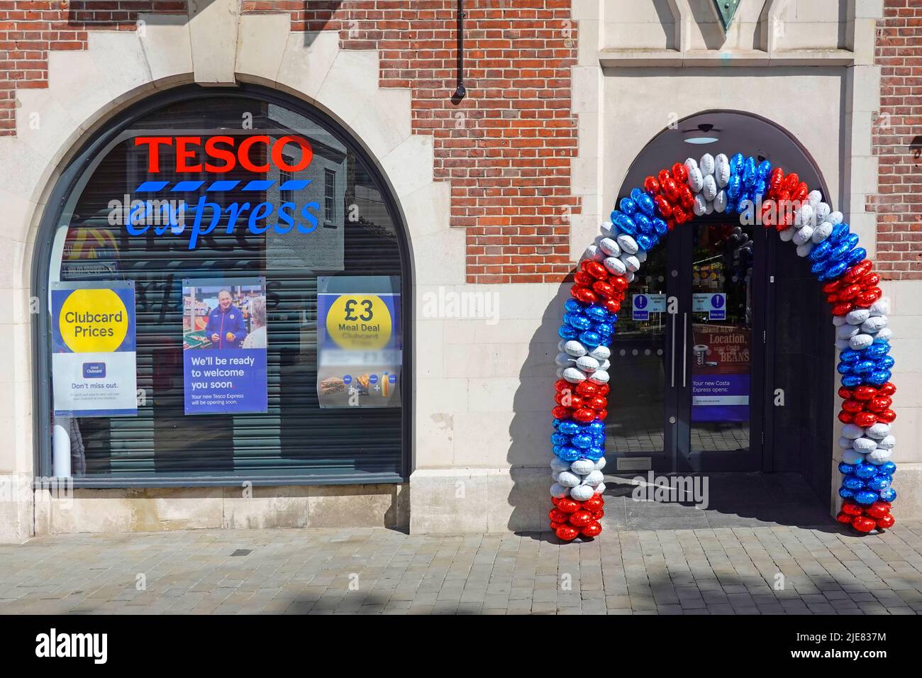 Garland red white blue decorations on customer entrance door opening ...