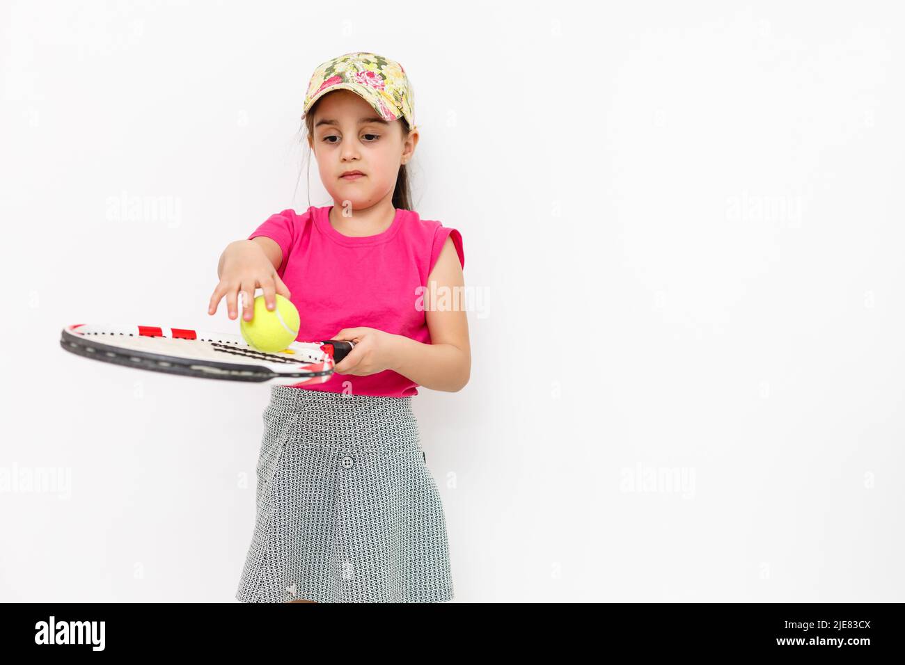 Girl Holding Tennis Racket And Tennis Ball Isolated On White Stock 7898