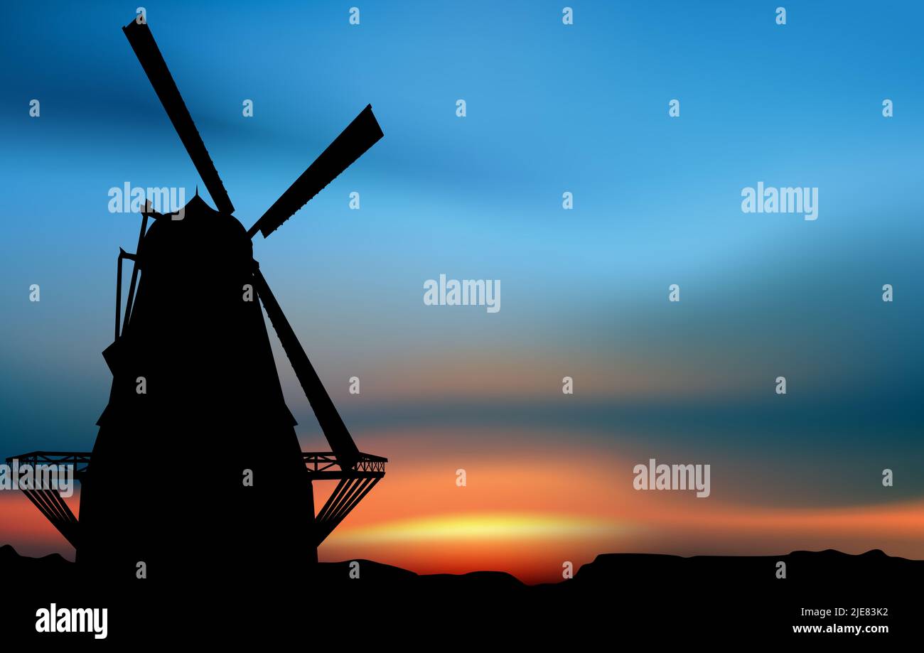 Windmill on the sunset background Stock Photo - Alamy