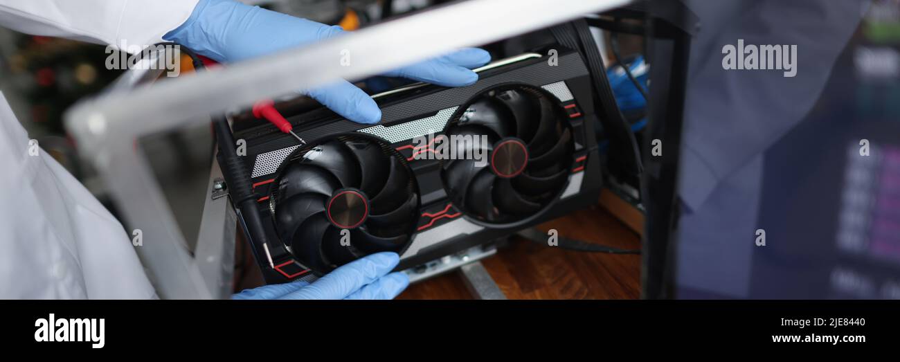 Man mechanic installing cooler fan with copper tubes on computer ...