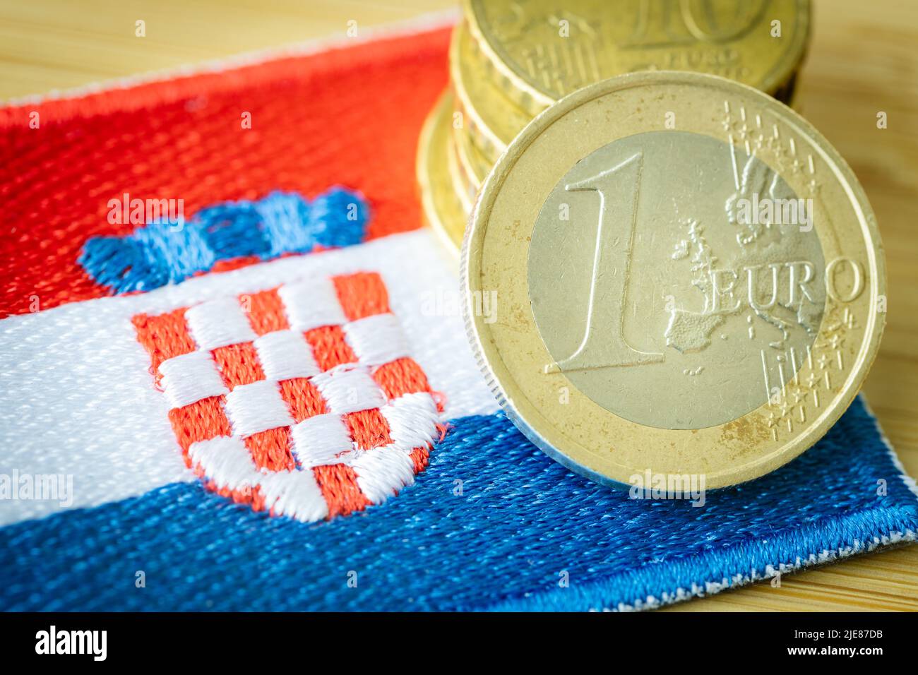 Croatian flag next to the 1 euro coin. Concept of Croatia joining the ...