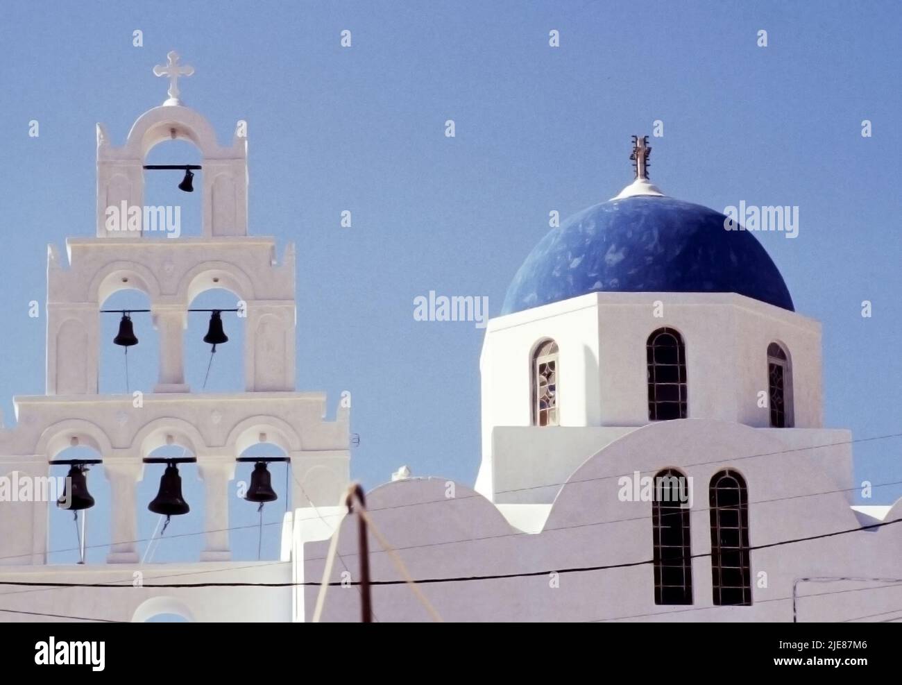 White and blue color church at the Pirgos village, Santorini island ...