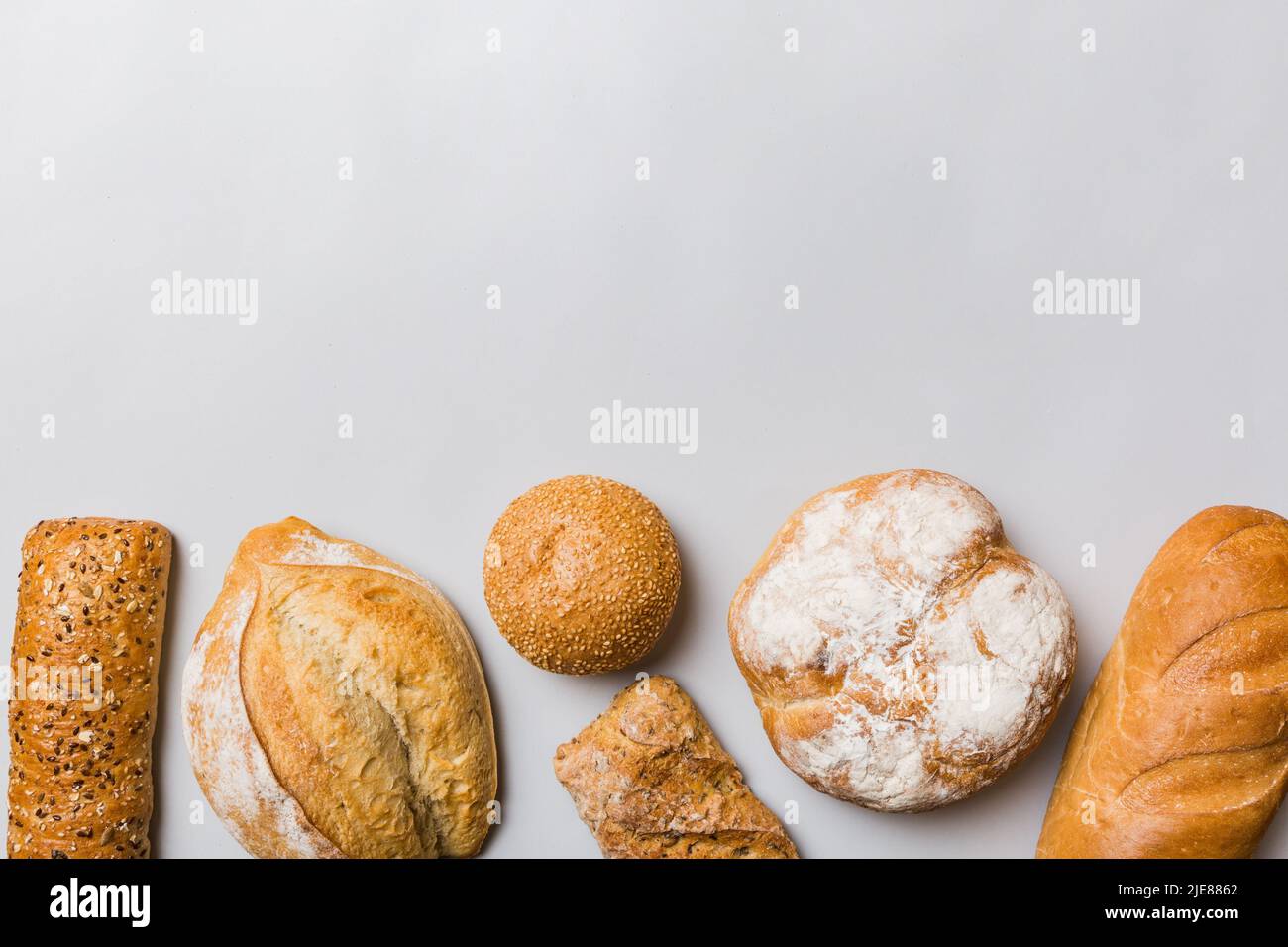 Homemade natural breads. Different kinds of fresh bread as background ...