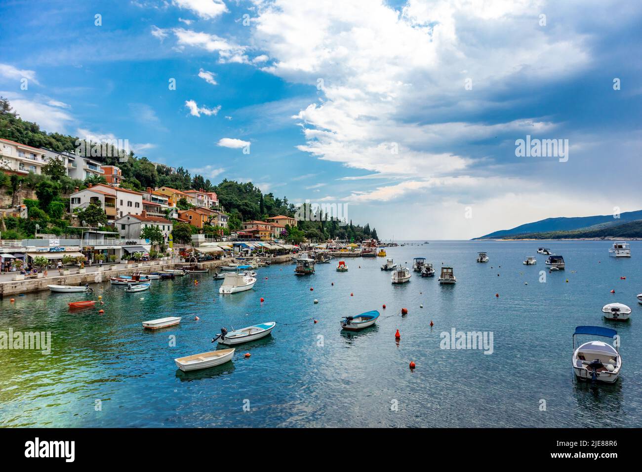 Summer beach walk in the port town of Rabac - Istria - Croatia Stock ...