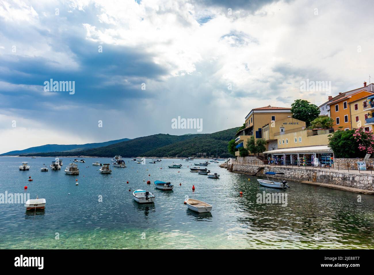 Summer beach walk in the port town of Rabac - Istria - Croatia Stock ...