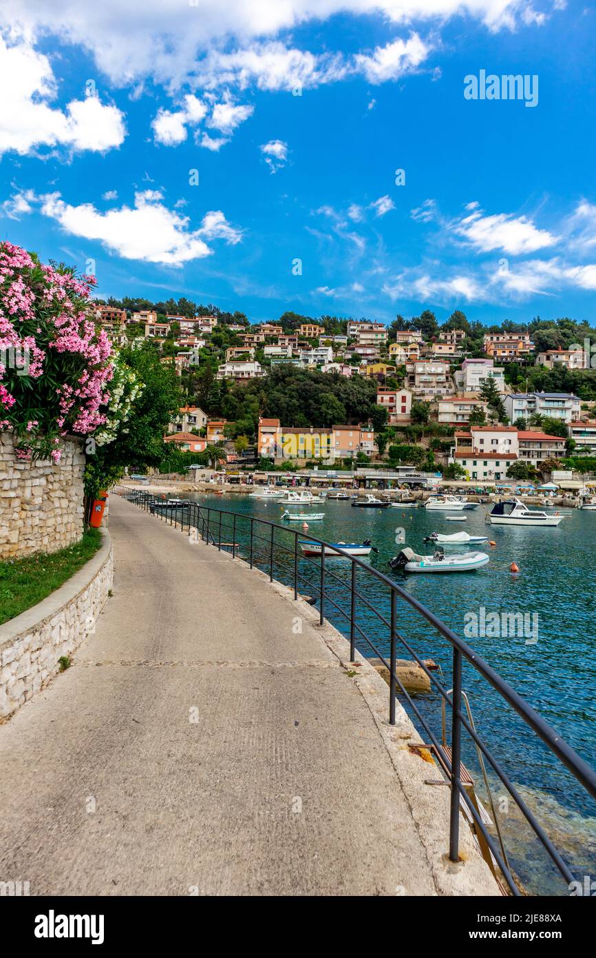 Summer beach walk in the port town of Rabac - Istria - Croatia Stock ...
