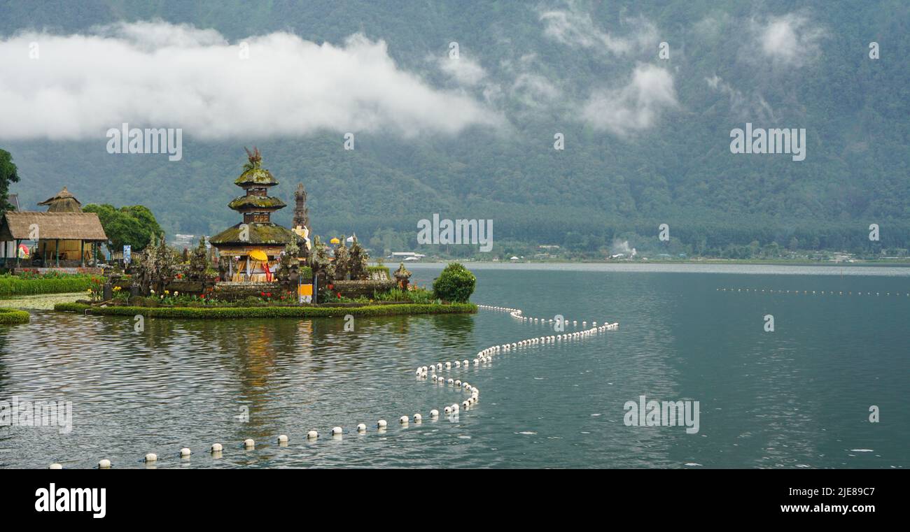 Scenic natural views of Lake Beratan in Bali. Green hills and clean ...