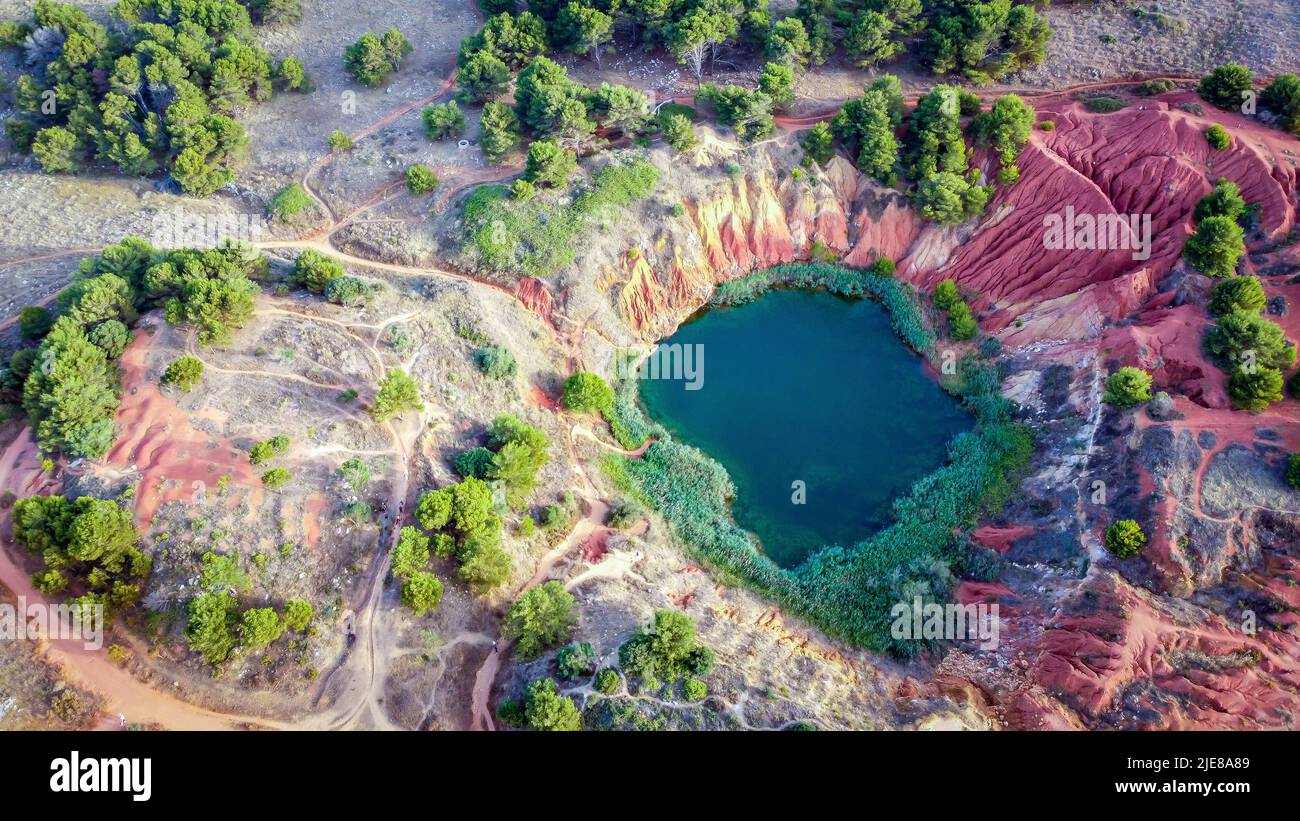 view of the lake of former open-pit bauxite mine near Otranto - Apulia ...