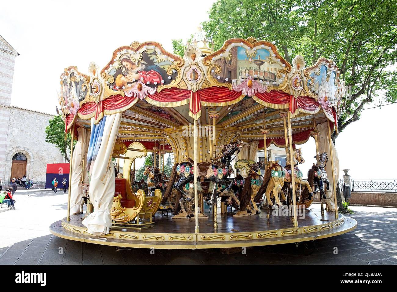 Old fashioned carouls in a medieval town of Assisi, Umbria, Italy Stock ...