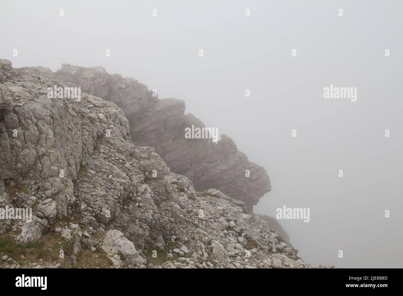 The view of mountain landscape through dense fog, Dolomites, Italian ...
