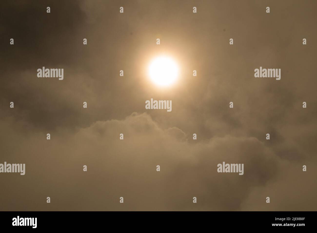 The view of the sun seeing through dense fog and clouds Stock Photo - Alamy