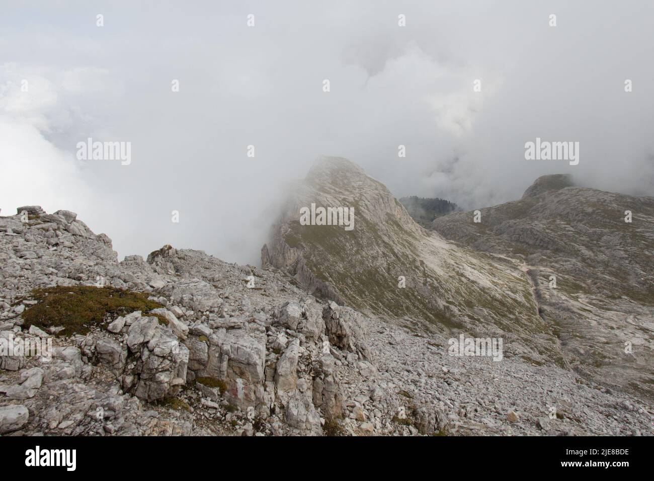 The view of mountain landscape seeing through dense fog, Dolomites ...