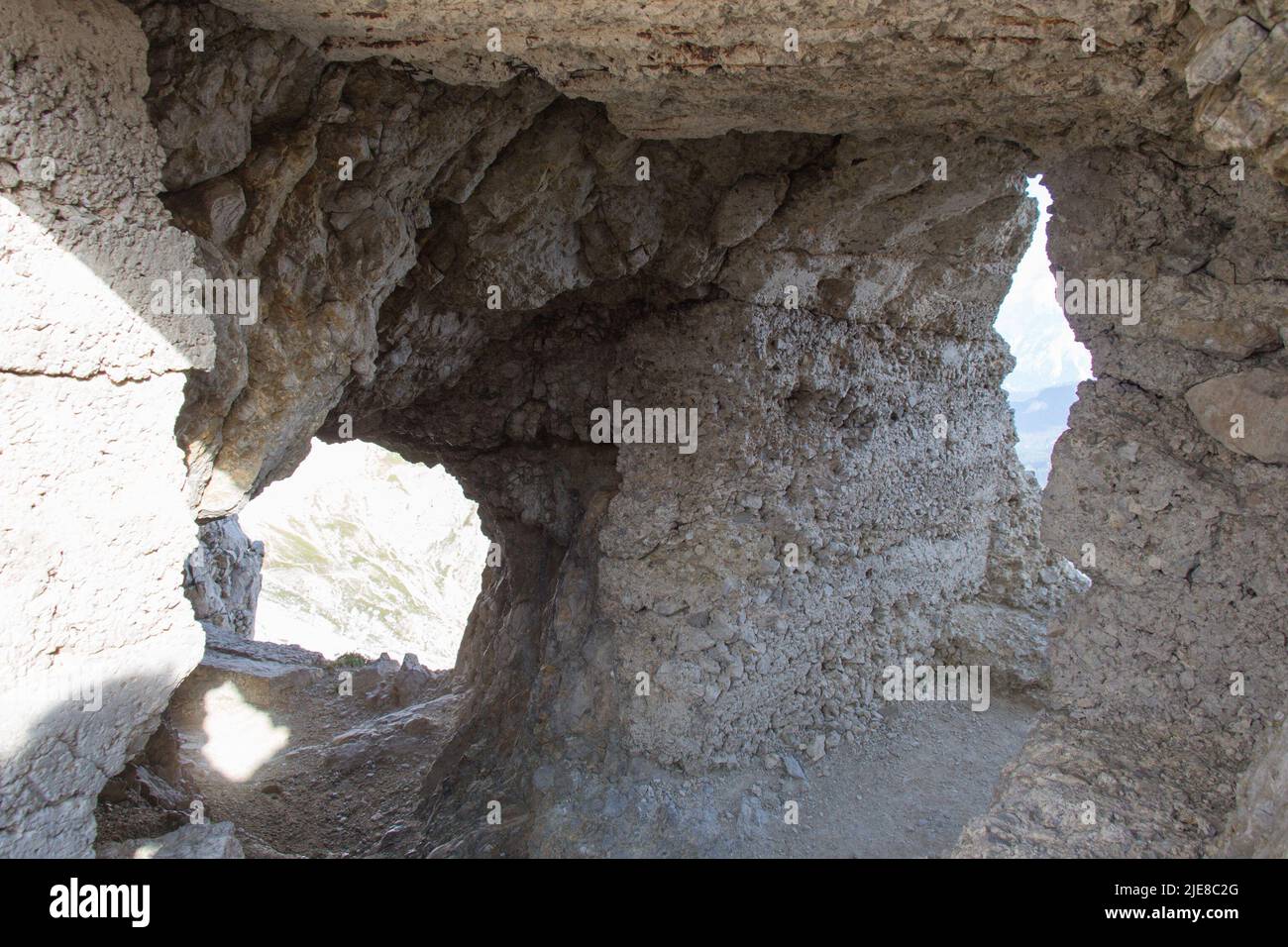 The view of tunnel windows inside mountain massif, Dolomites, Italian ...