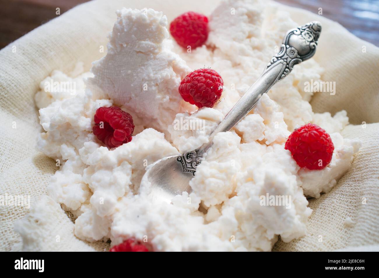 domestic cottage cheese with raspberry Stock Photo - Alamy